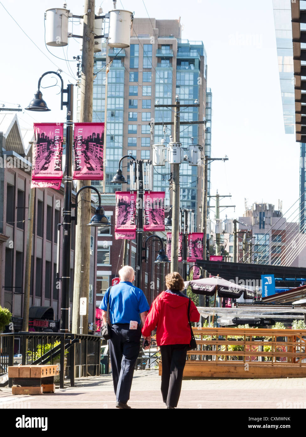 Mature Couple Strolling through Yaletown Neighborhood in Vancouver ...