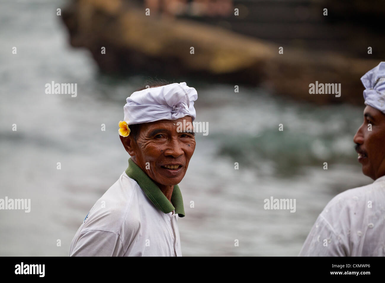 Balinese in traditional Clothes at the Hindu Temple Pura Tanahlot on ...