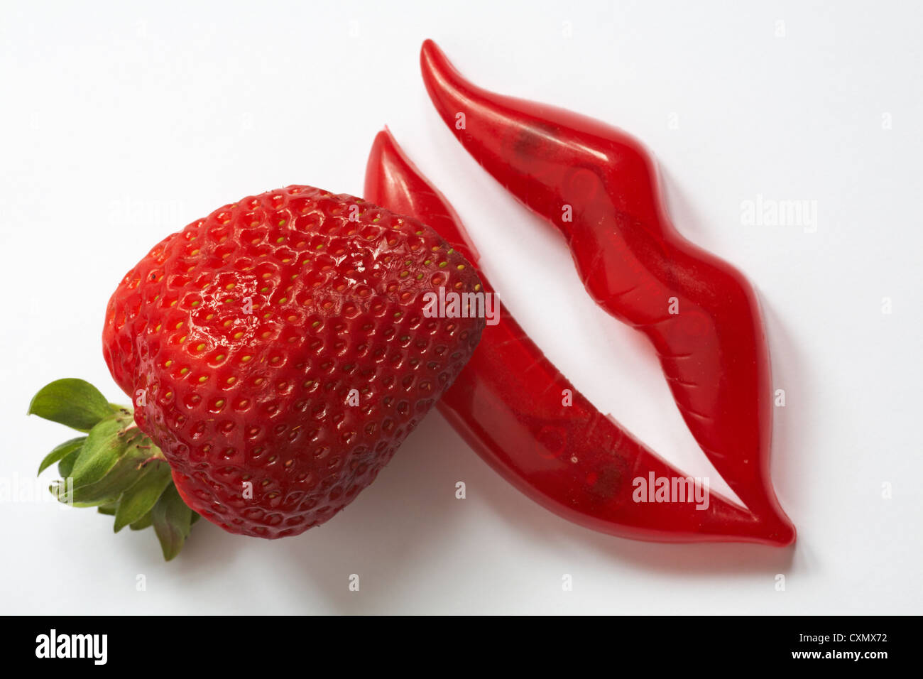 Feeling fruity - red lips and strawberry isolated on white background ...
