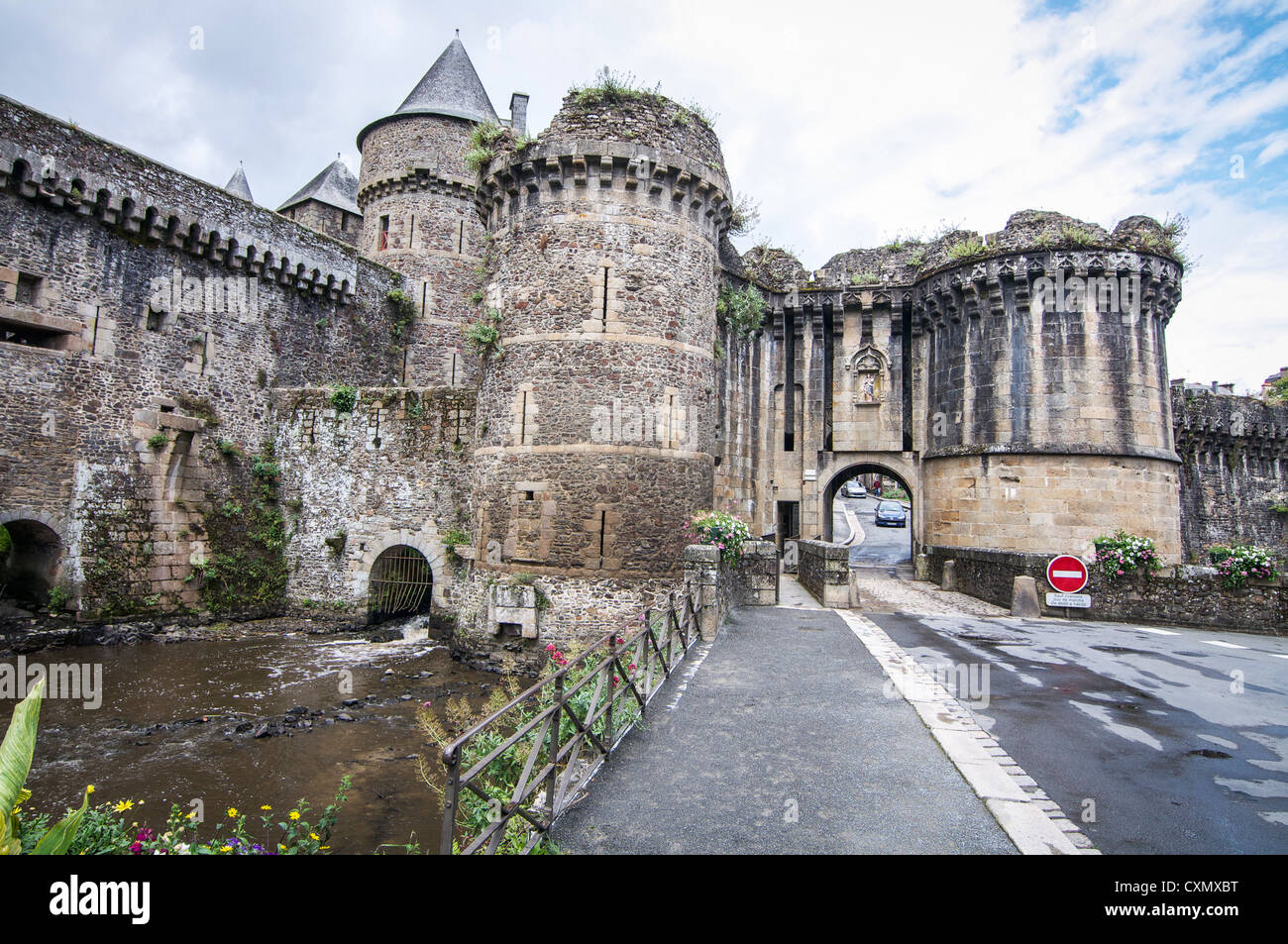 An arched entry passage through one of the fortified walls of the ...