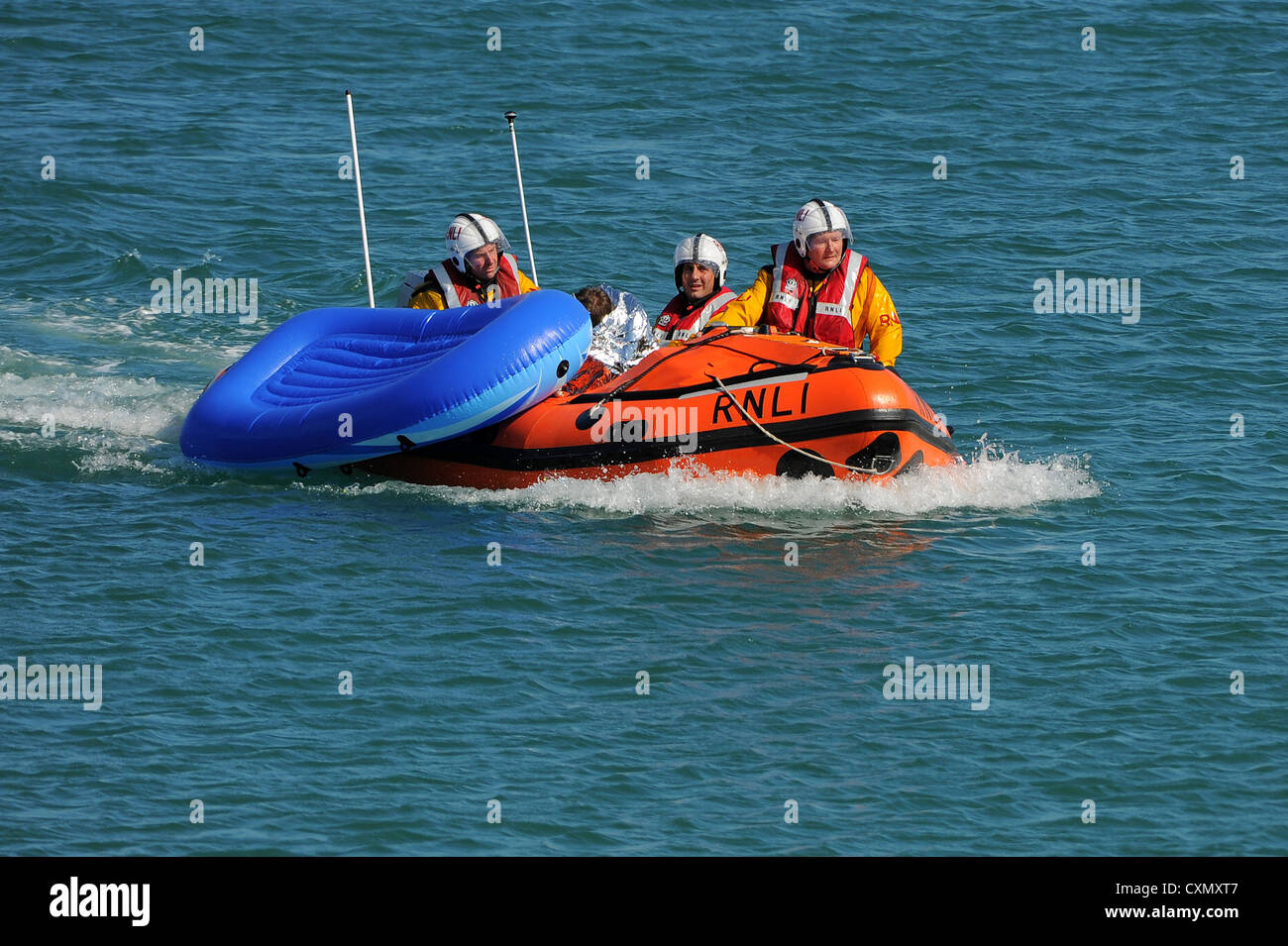 A man is rescued by the Dartmouth RNLI Inshore Lifeboat after being ...