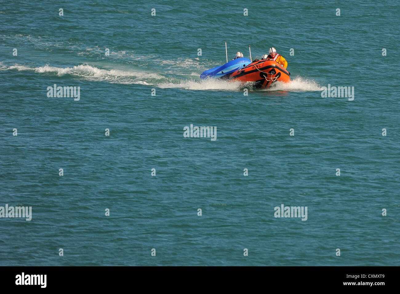 A man is rescued by the Dartmouth RNLI Inshore Lifeboat after being ...