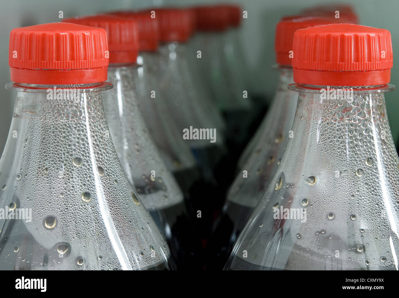 bottles of cola with drops Stock Photo - Alamy