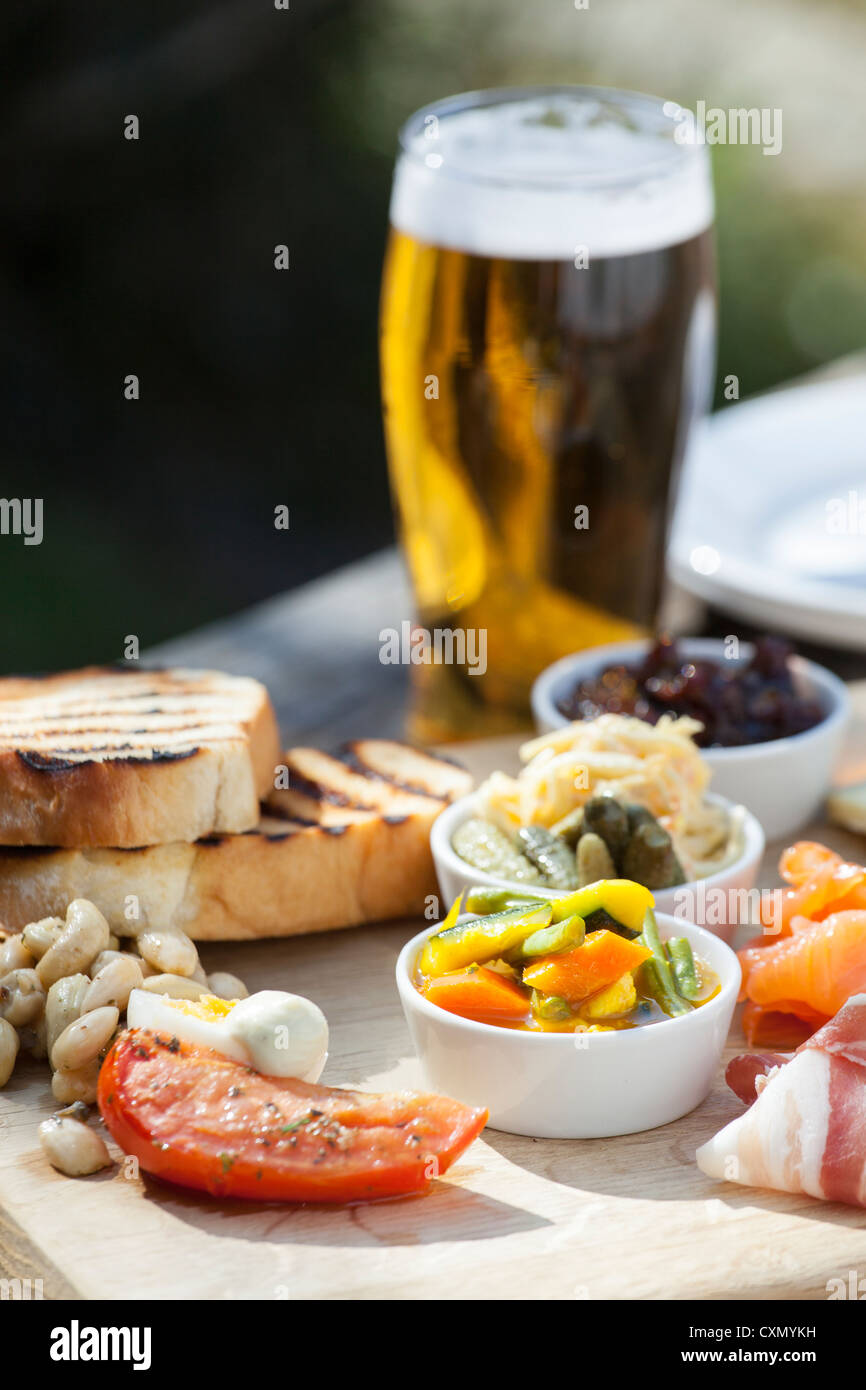 Lunch with a pint of beer, fresh produce Stock Photo - Alamy