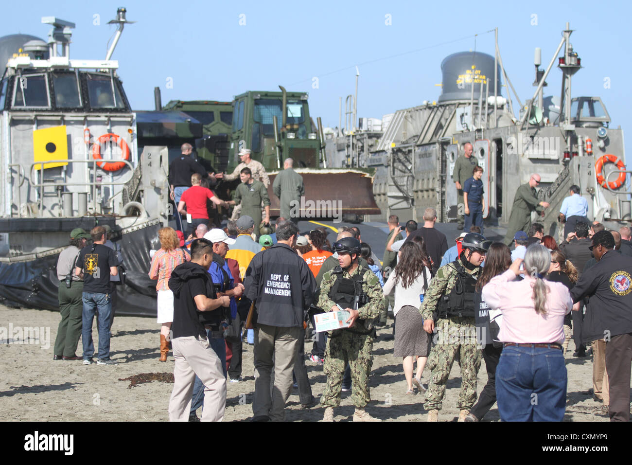 Sailors with Beach Master Unit 1 coordinate a beach landing ...
