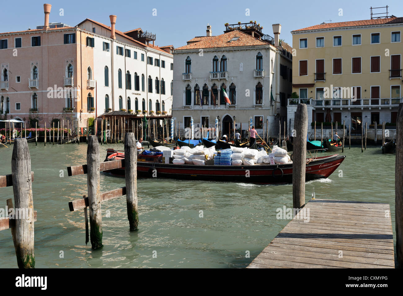 Boat carrying a full load of goods, Venice, Italy Stock Photo - Alamy