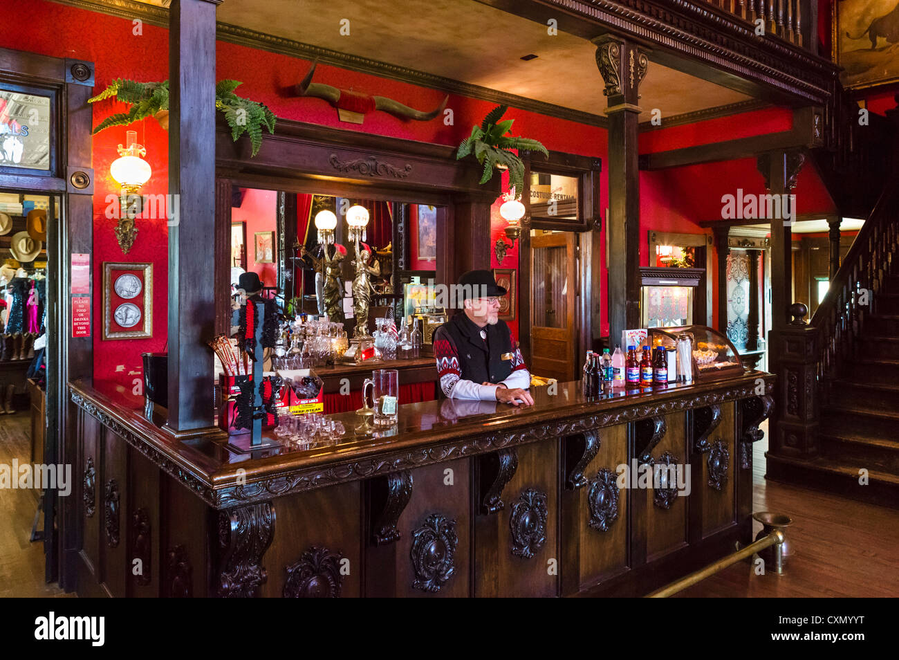 Barman in the saloon on Main Street, "1880 Town" western attraction ...