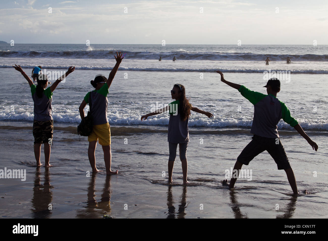People doing Gymnastics on Kuta Beach on Bali Stock Photo - Alamy
