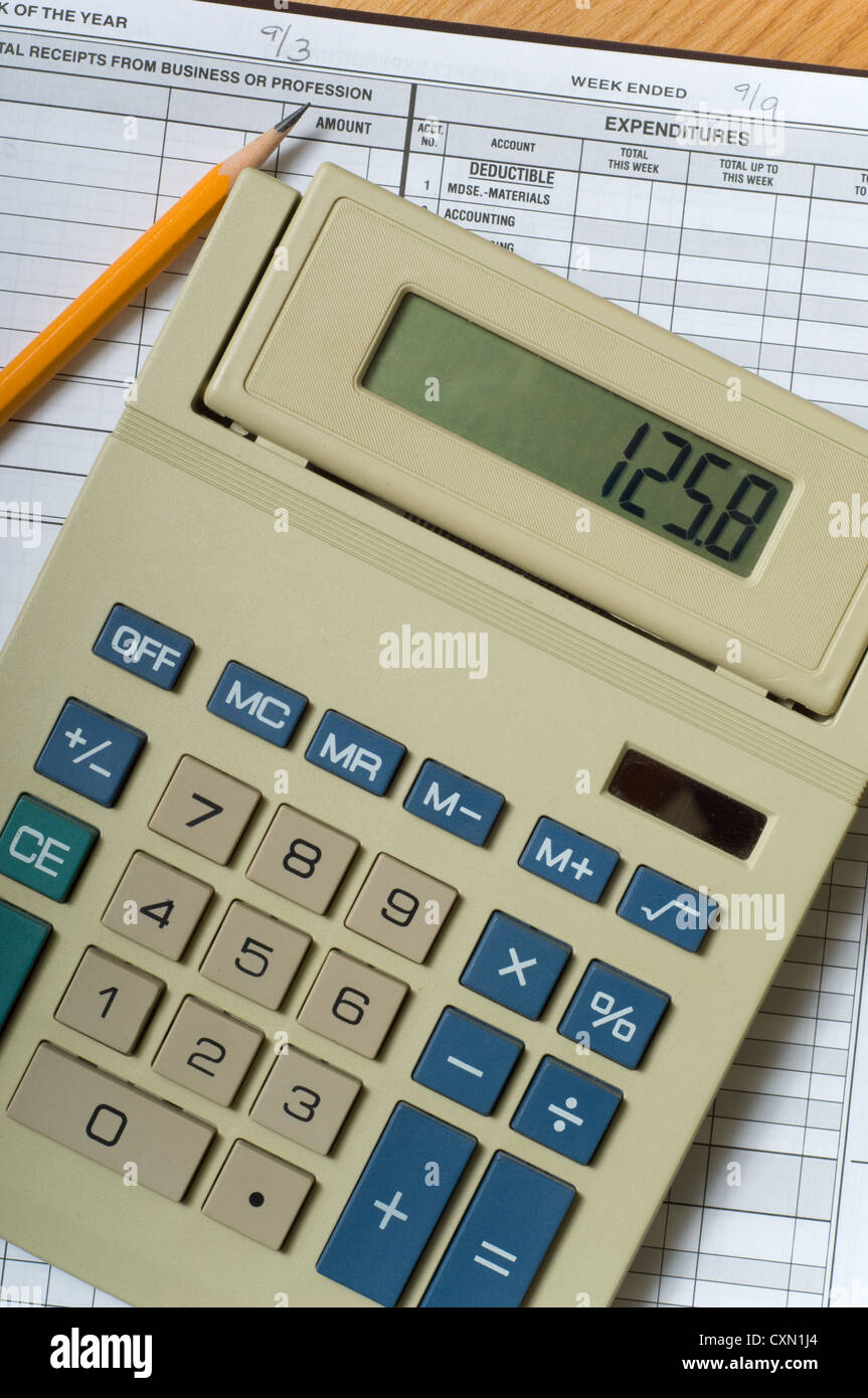 Items used in small business accounting including a calculator and an ...