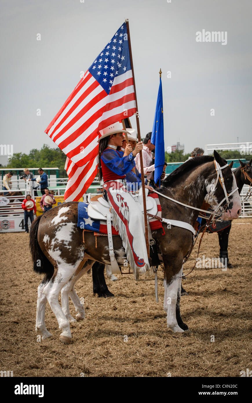 Rodeo parade of women bearing US flags Stock Photo - Alamy