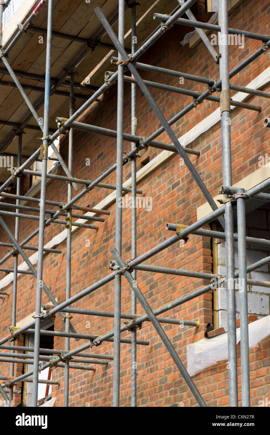 scaffolding on the side of a new building Stock Photo - Alamy