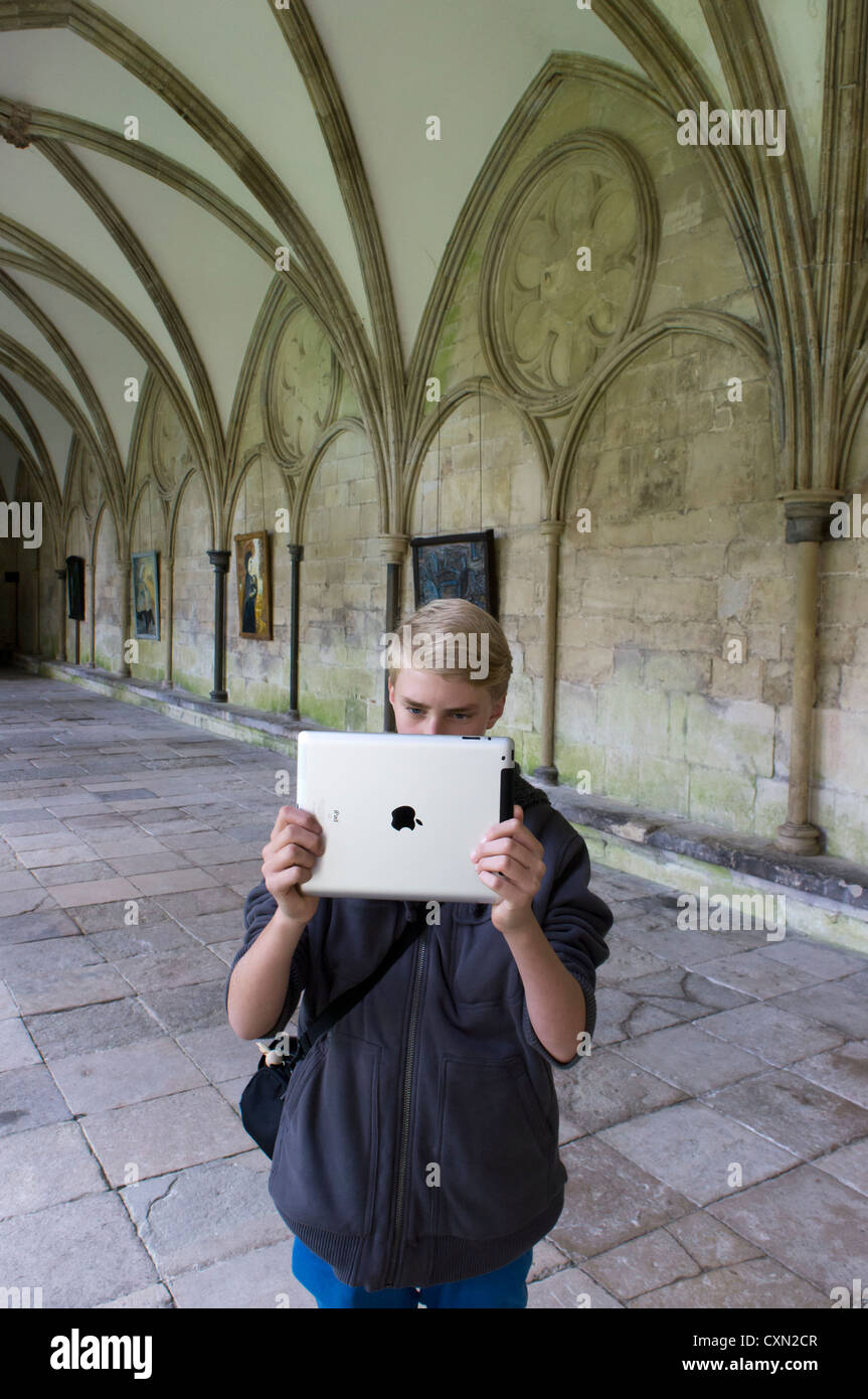 Young teenage boy using an Apple iPad Stock Photo - Alamy