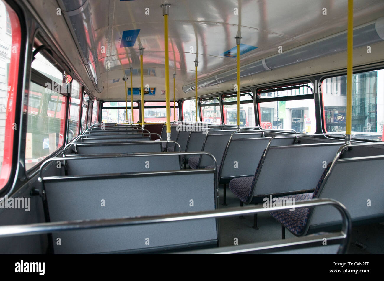 Interior upper deck of London Routemaster bus. Wide shot from rear ...