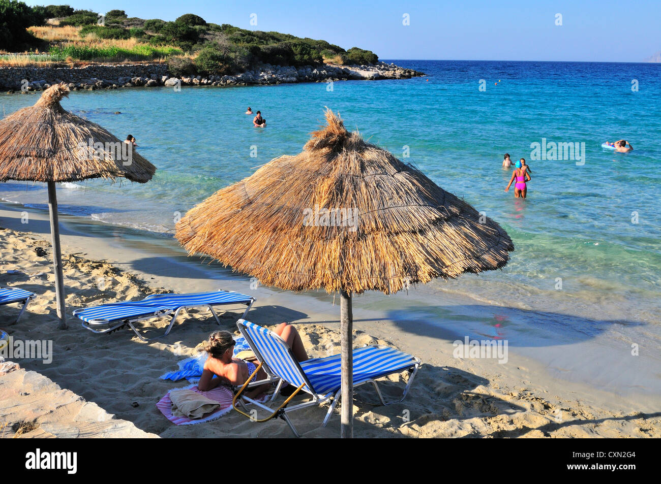 People swimming and relaxing on Istro, beach one of Crete's northern ...