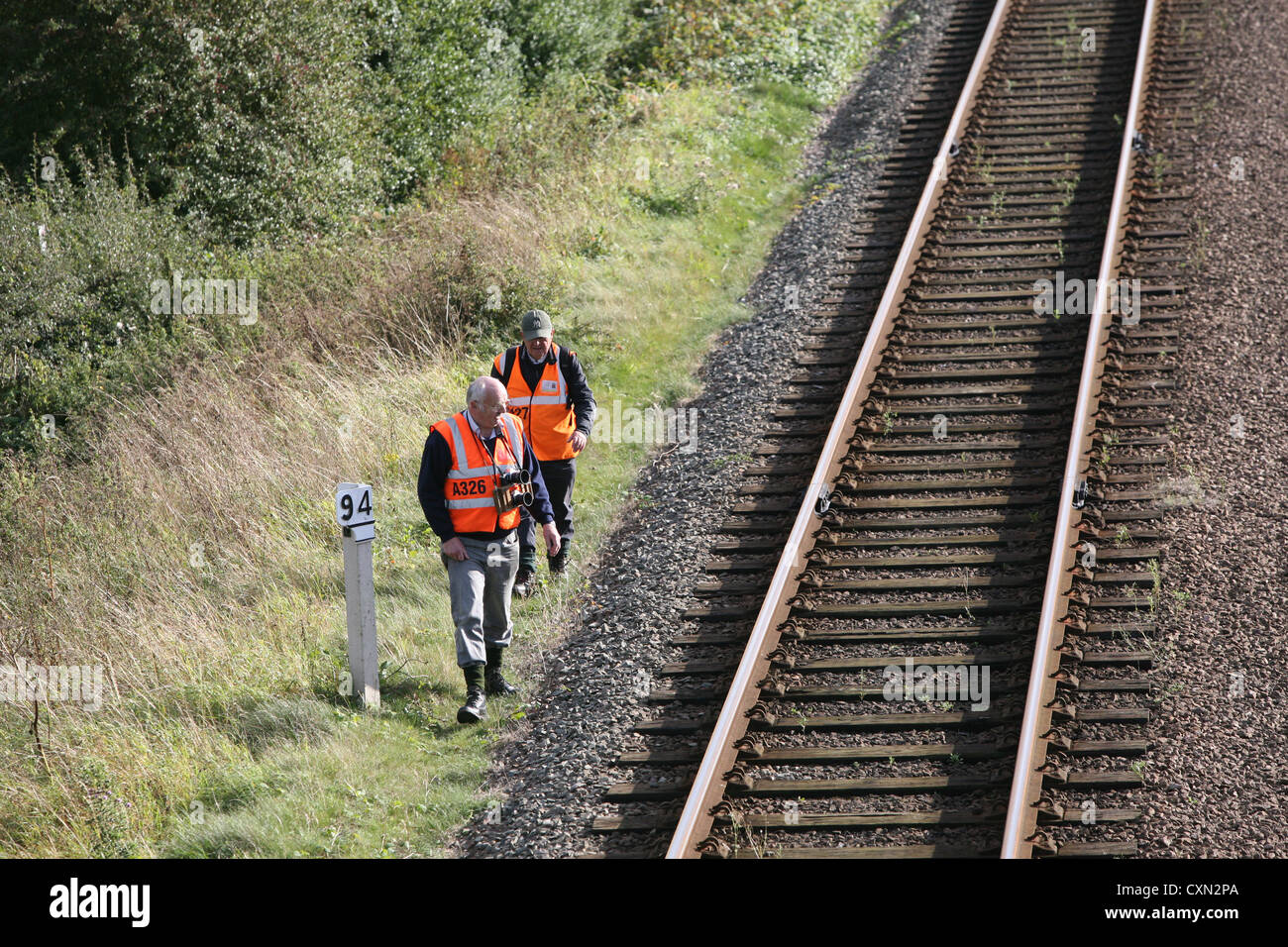 two photographers who have line side access during a steam train gala ...