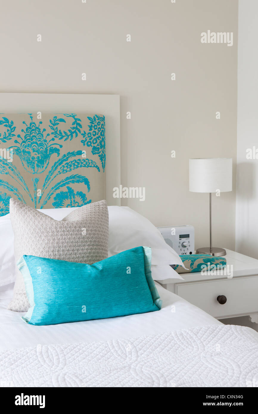 Modern, bright bedroom with colourful cushions Stock Photo - Alamy