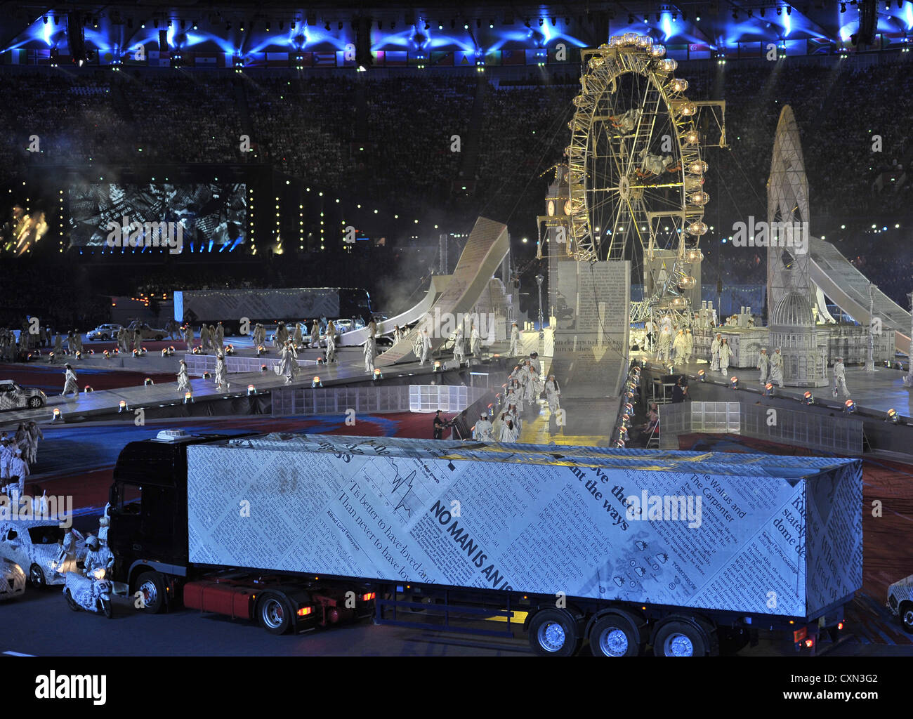 Lorries covered in newspaper drive in Stock Photo - Alamy