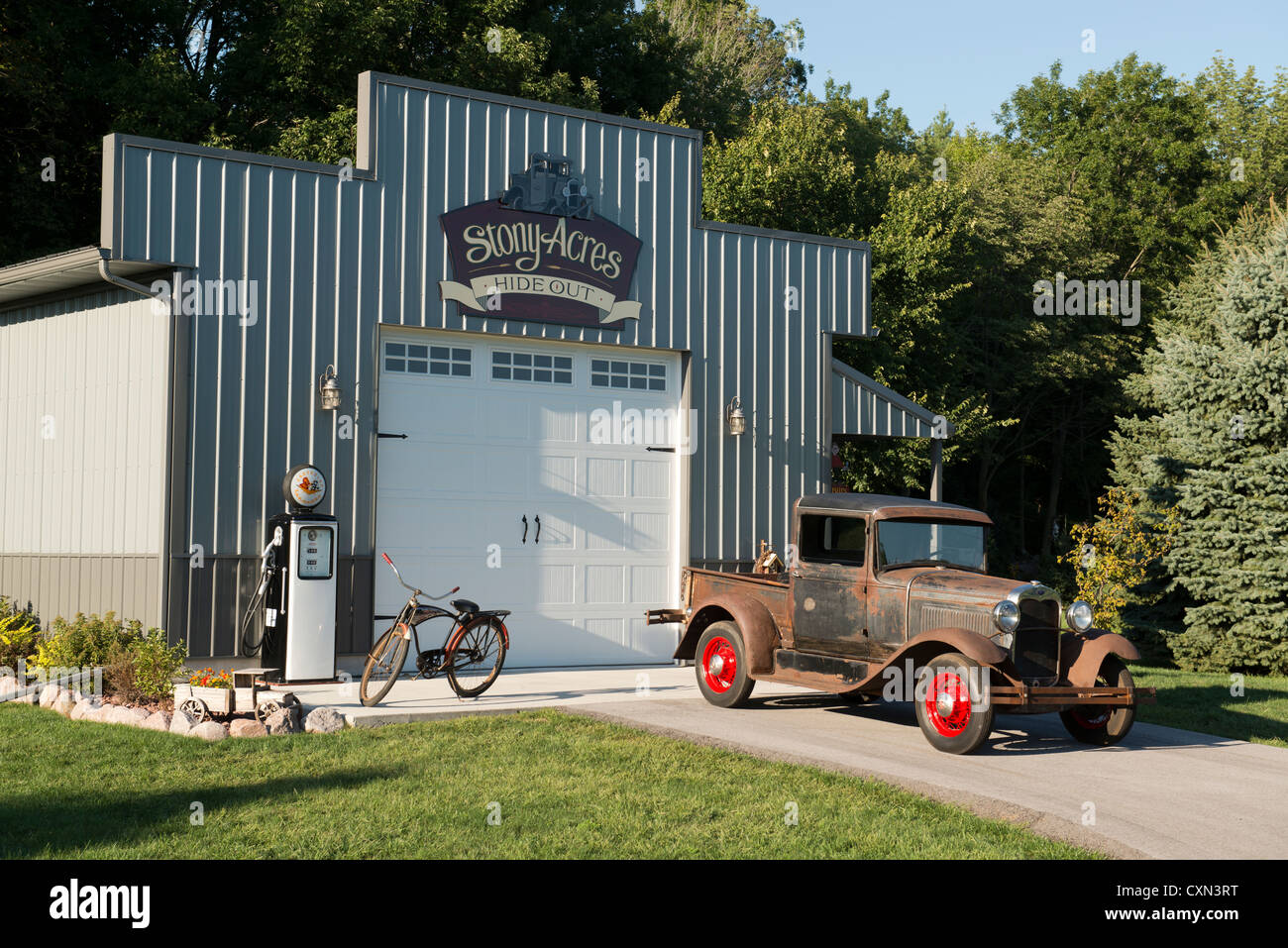 Old Ford truck in front of garage Stock Photo - Alamy