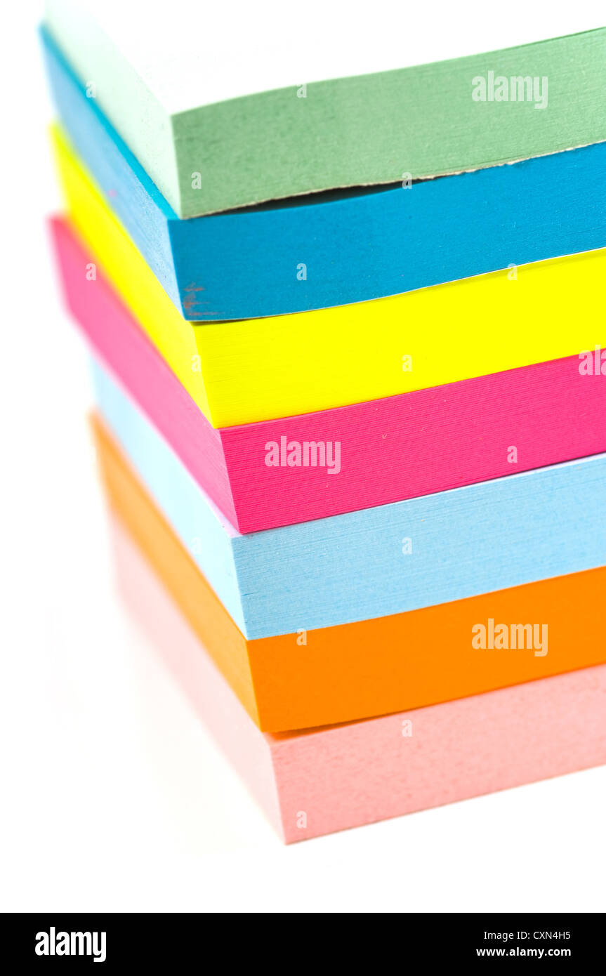 Stack of brightly colored sticky notes, slightly overexposed for effect ...