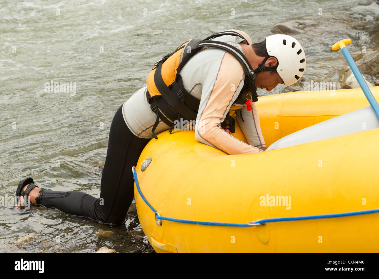 Rafting Boat Maintenance The Pilot Preparing The Boat For The Next ...