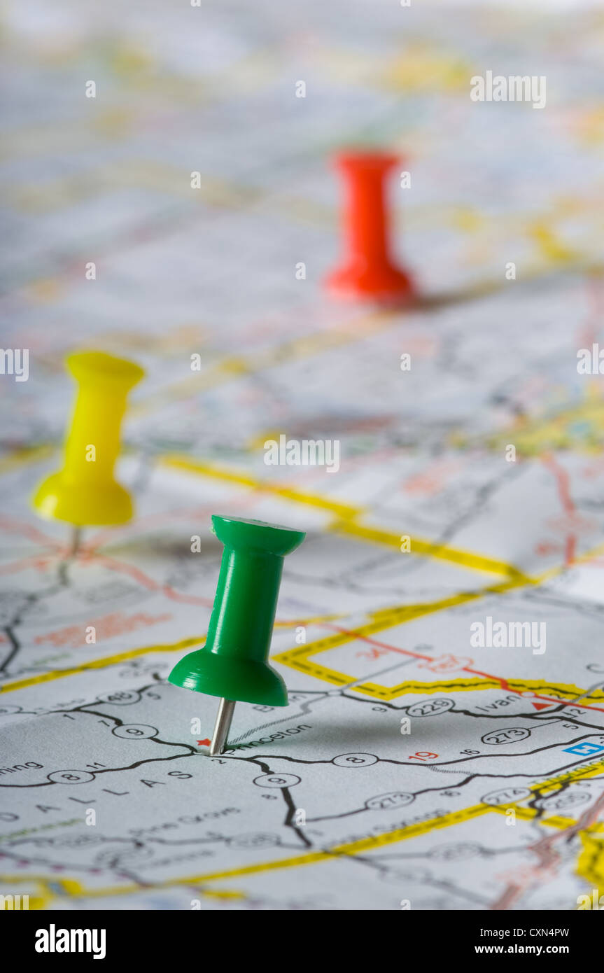 Pushpin on map pinpointing a particular area, map in not ...