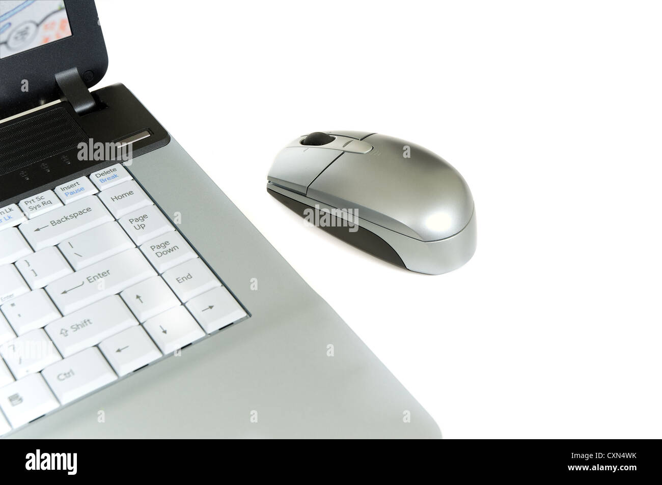 Laptop computer and mouse on white background Stock Photo - Alamy