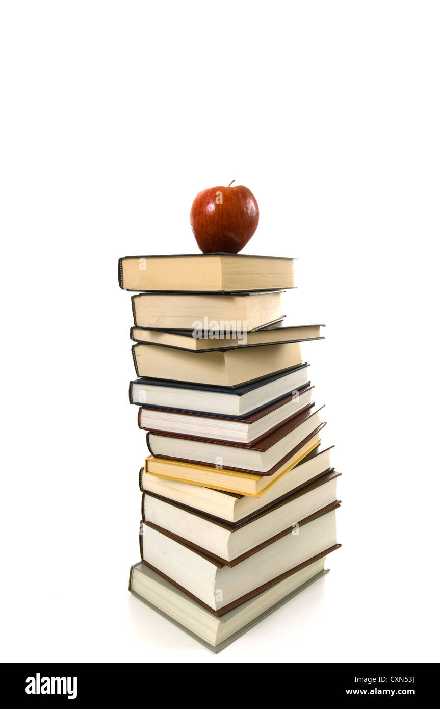 Huge stack of books with a shiny red apple on top Stock Photo - Alamy