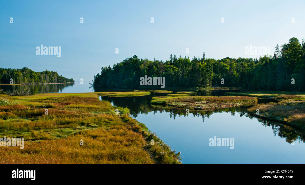 Morning reflections on a tranquil river in cape breton island Stock ...