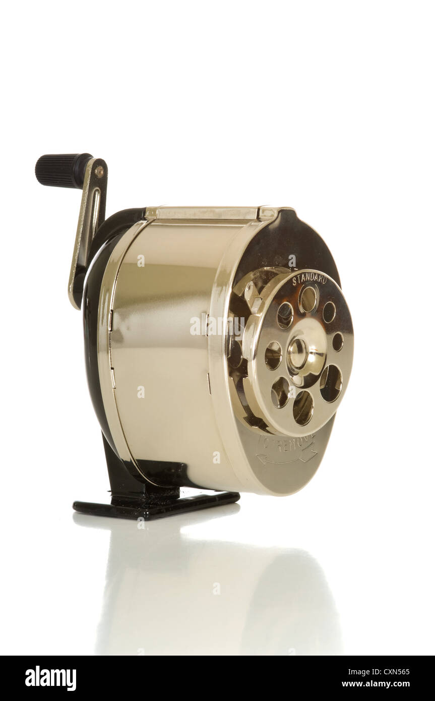 Manual pencil sharpener on white background with reflection in surface ...