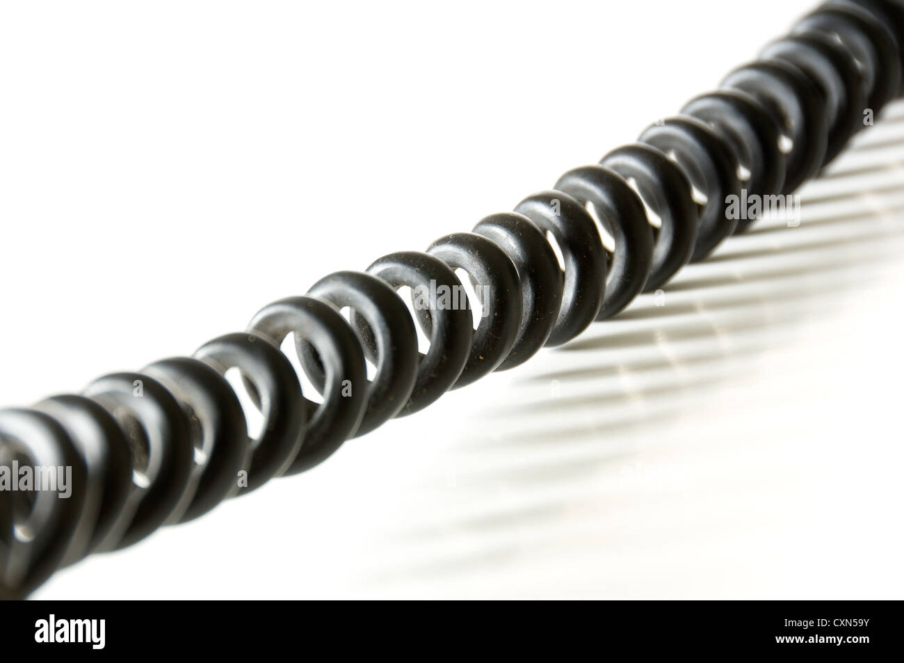 Black antique telephone cord - connection, coiled Stock Photo - Alamy