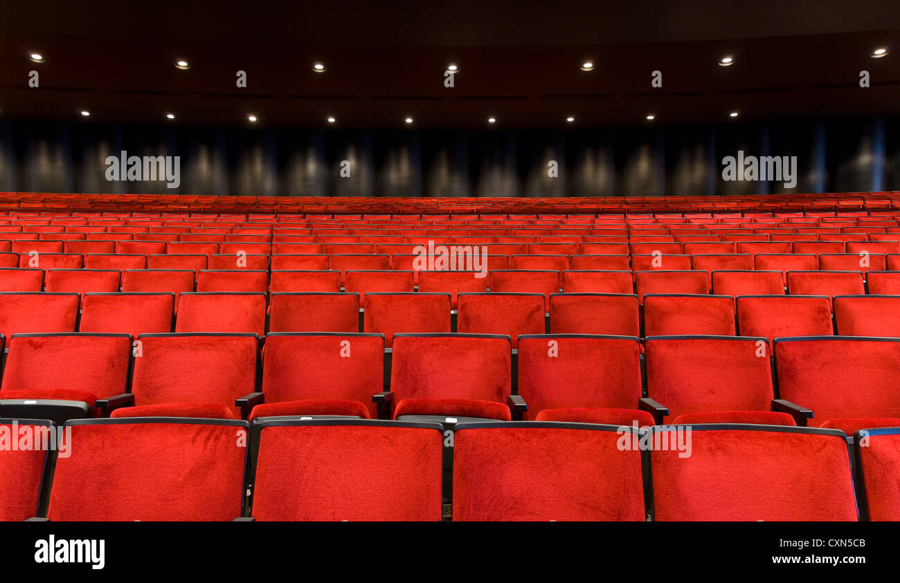 Red velvet concert hall seating background Stock Photo - Alamy