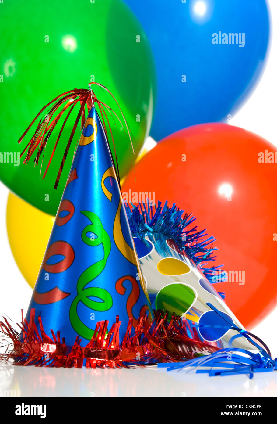 Primary color balloon bouquet with party hats Stock Photo - Alamy