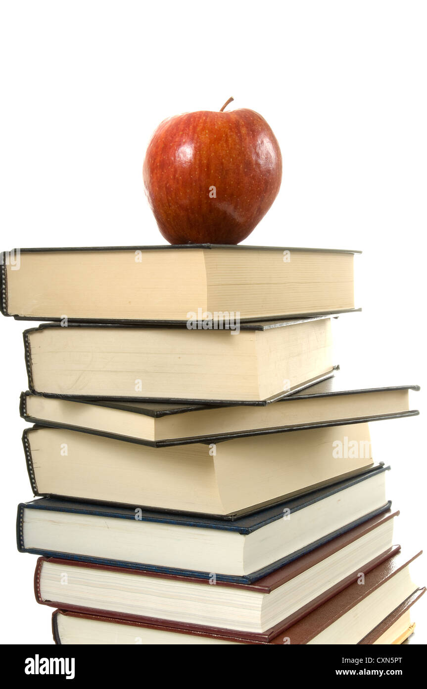 Huge stack of books with a shiny red apple on top Stock Photo - Alamy