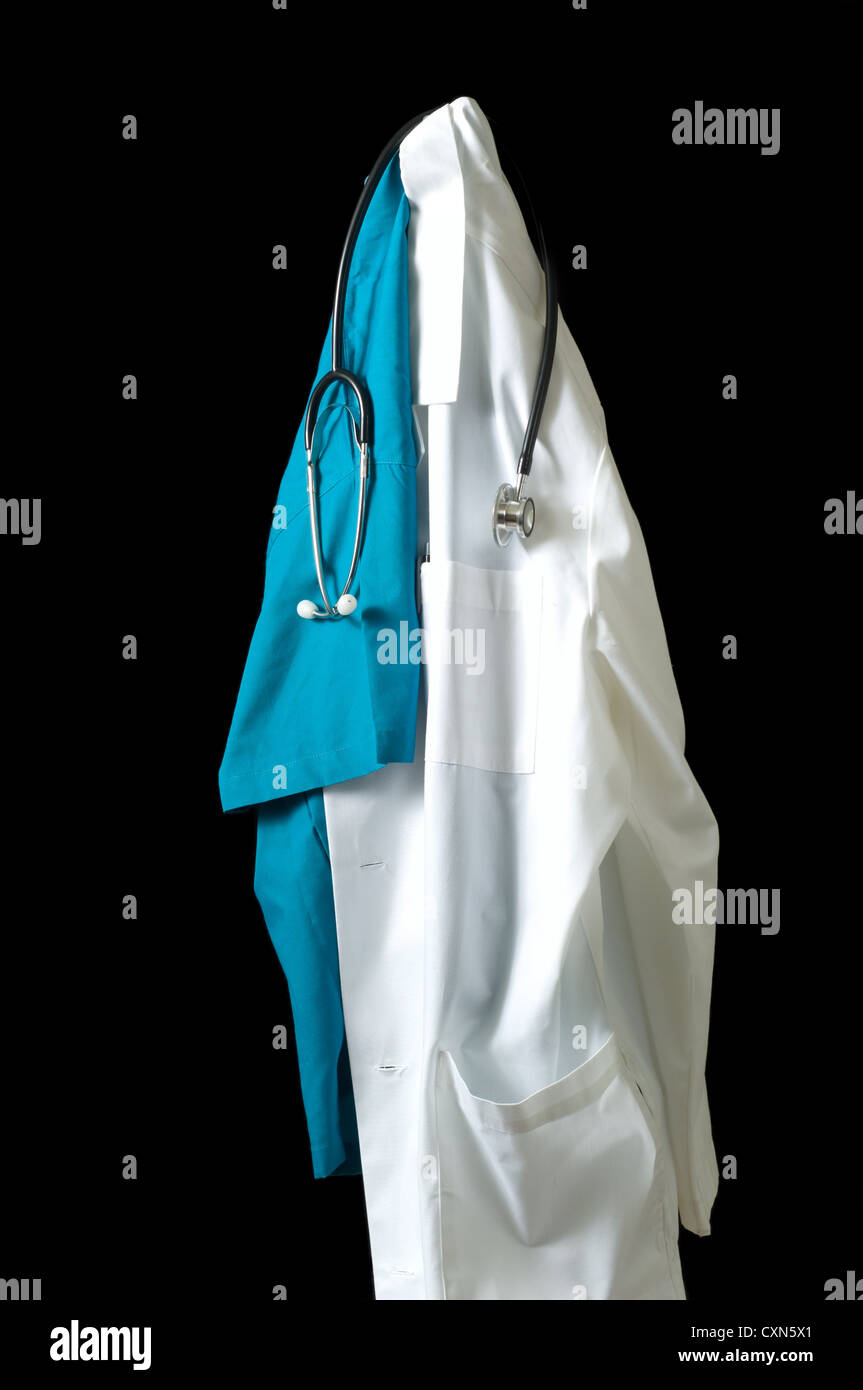 Doctors lab coat, scrubs and stethoscope hanging on a coat rack on a ...