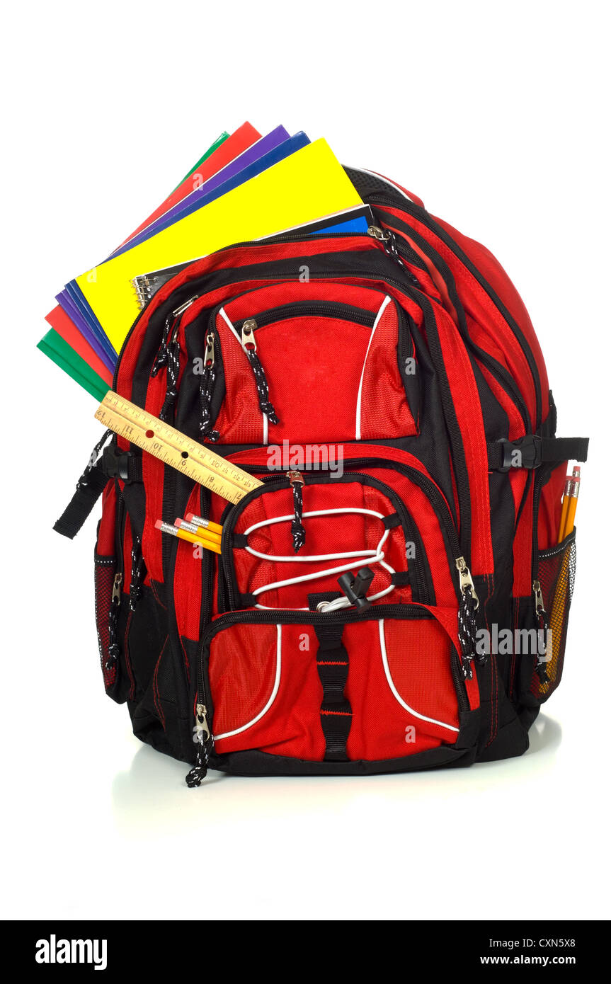 Red backpack overflowing with school supplies including pencils, rulers ...