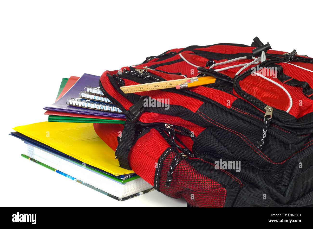 Red backpack overflowing with school supplies including pencils, rulers ...