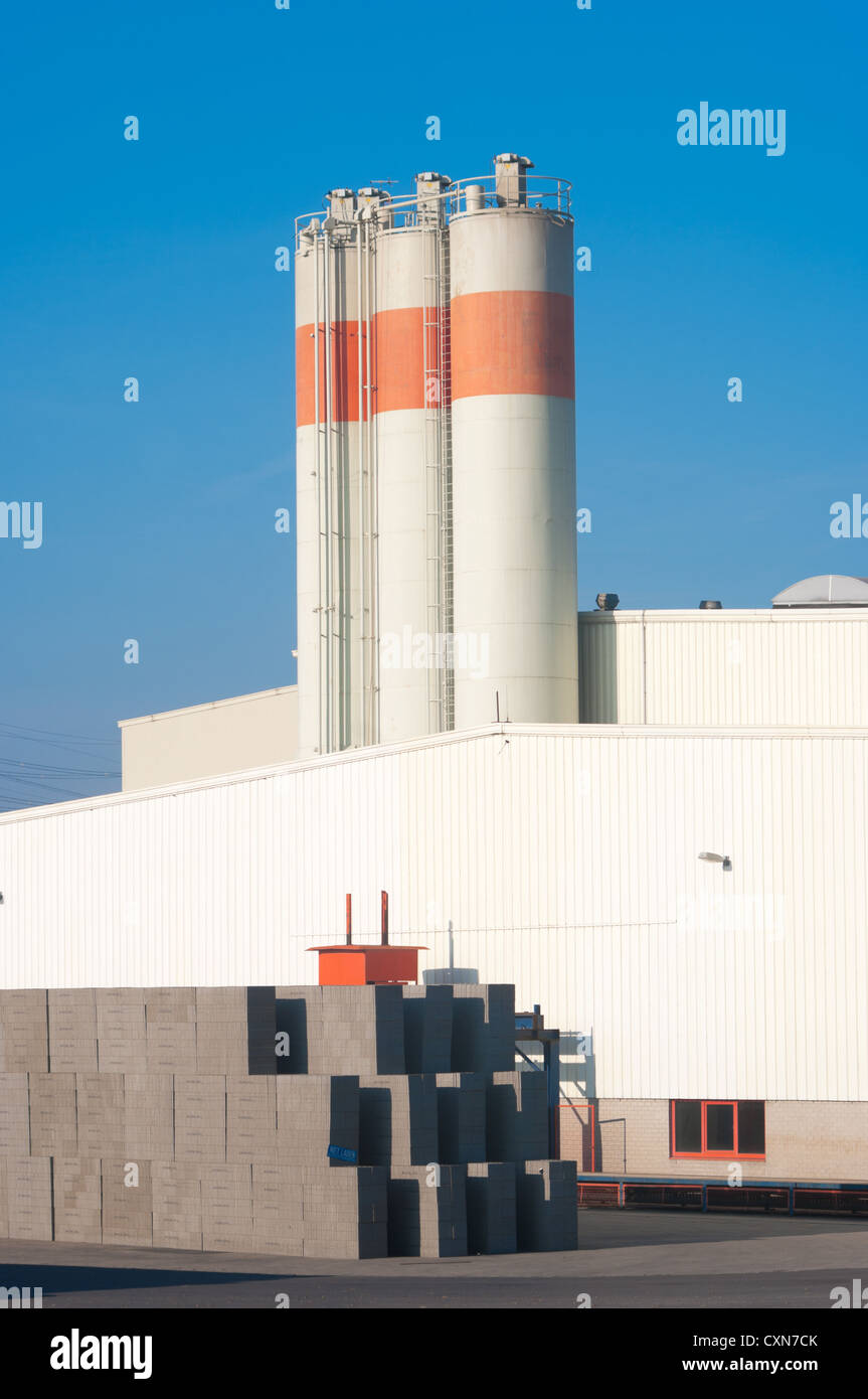 a group of silos as part of a concrete factory Stock Photo - Alamy