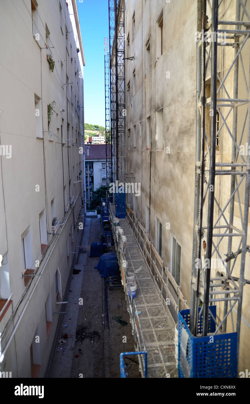 A wall in a narrow passage being painted Stock Photo - Alamy