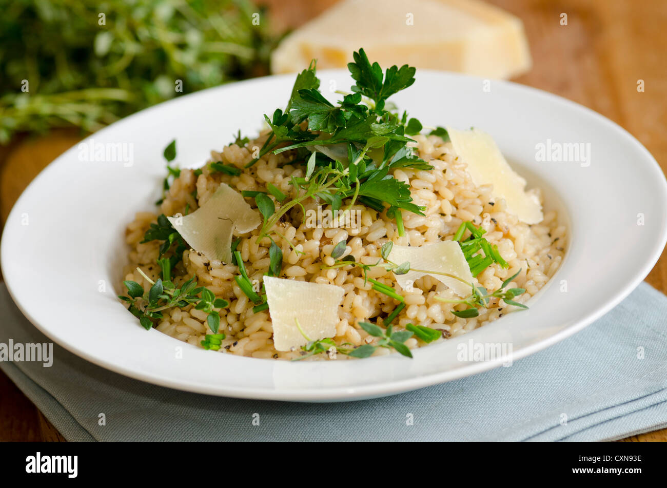 Herby risotto on a plate Stock Photo - Alamy