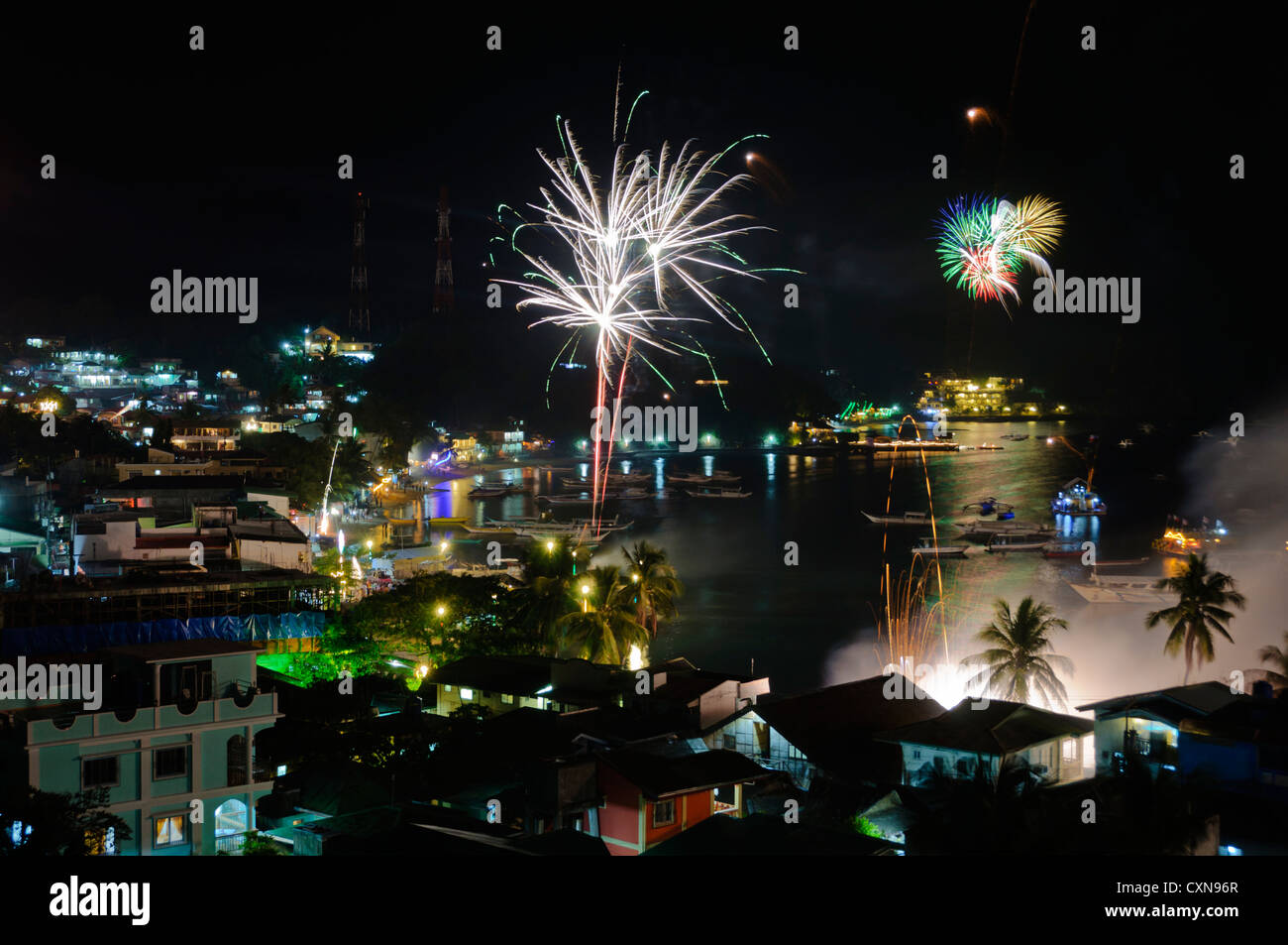 Happy New Year fireworks firework display over the tropical Asian ...