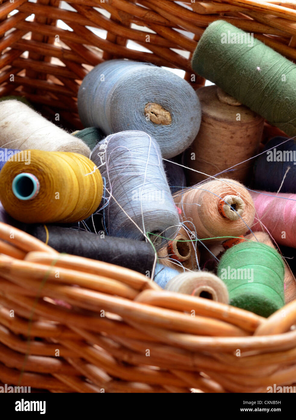 reels of cotton in wicker basket Stock Photo - Alamy
