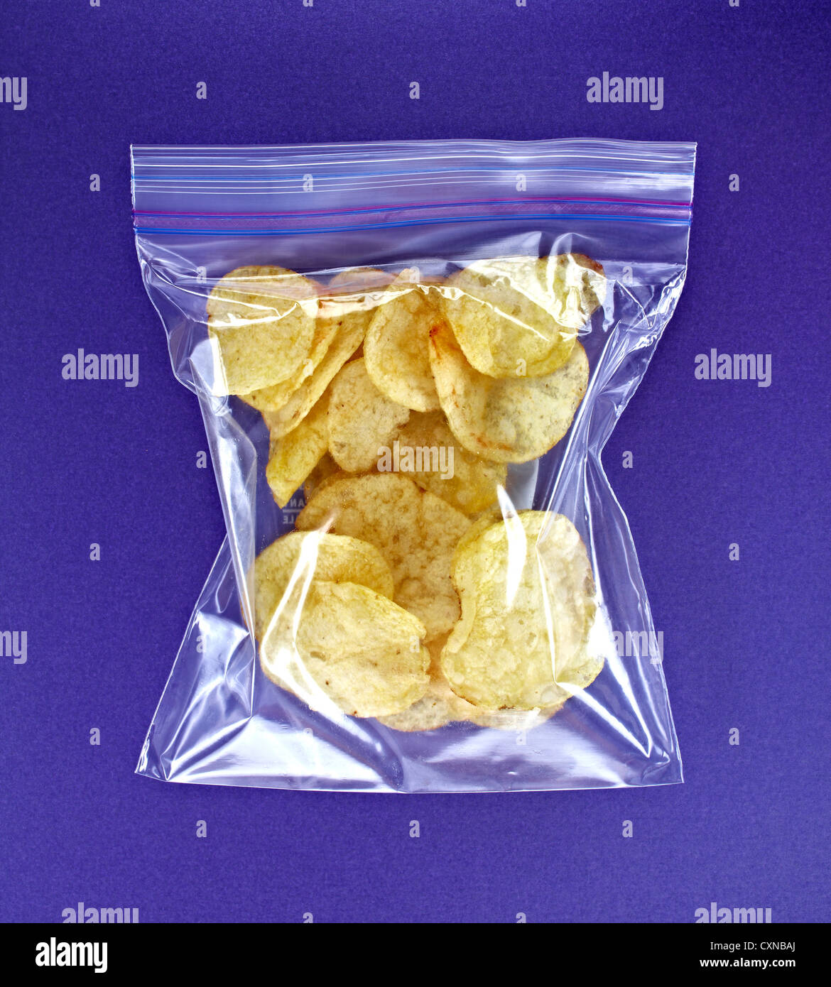 Crisps In Resealable Bag on Purple Background Stock Photo - Alamy