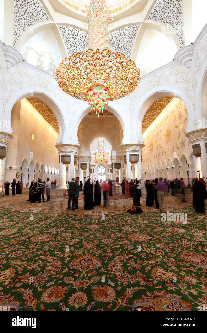 Visitors inside of the Sheikh Zayed Mosque in Abu Dhabi, United Arab ...
