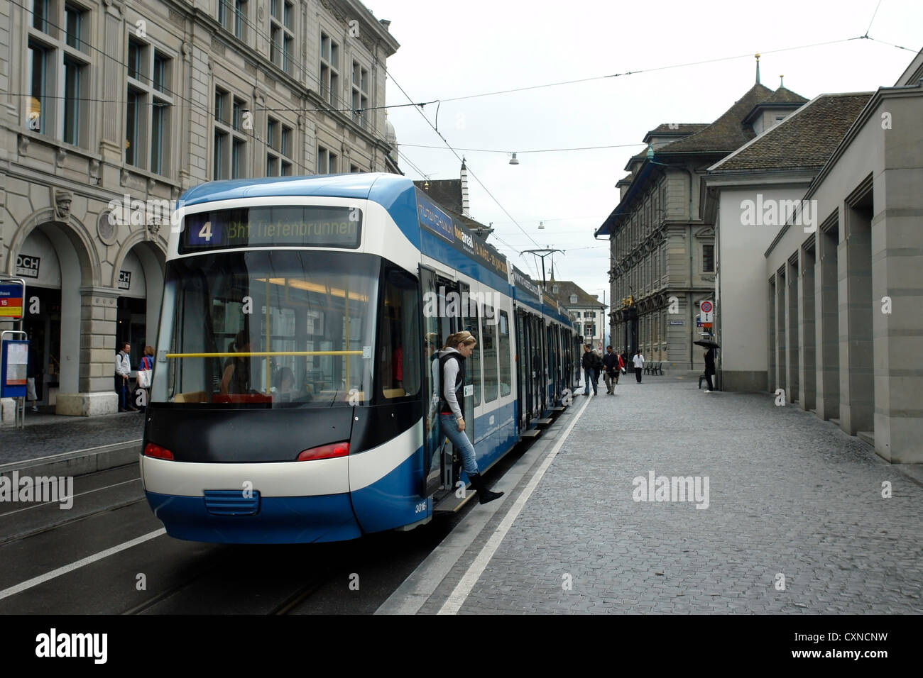 Passengers on a tram inside Zurich. The tram is a reliable and ...