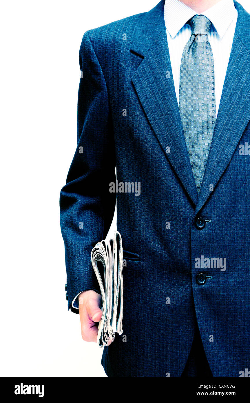 a businessman holding newspapers in his hand Stock Photo - Alamy