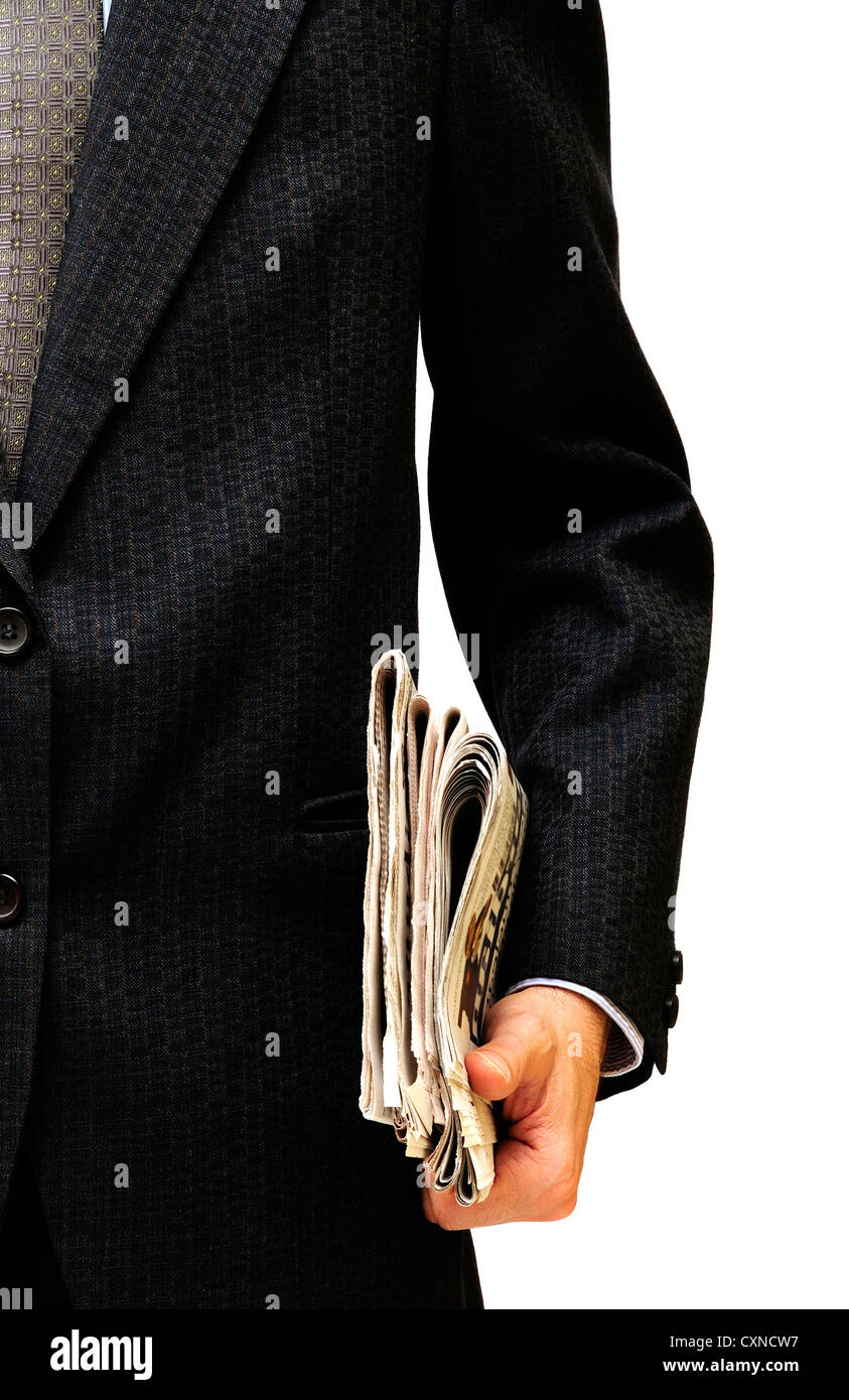 a businessman holding newspapers in his hand Stock Photo - Alamy