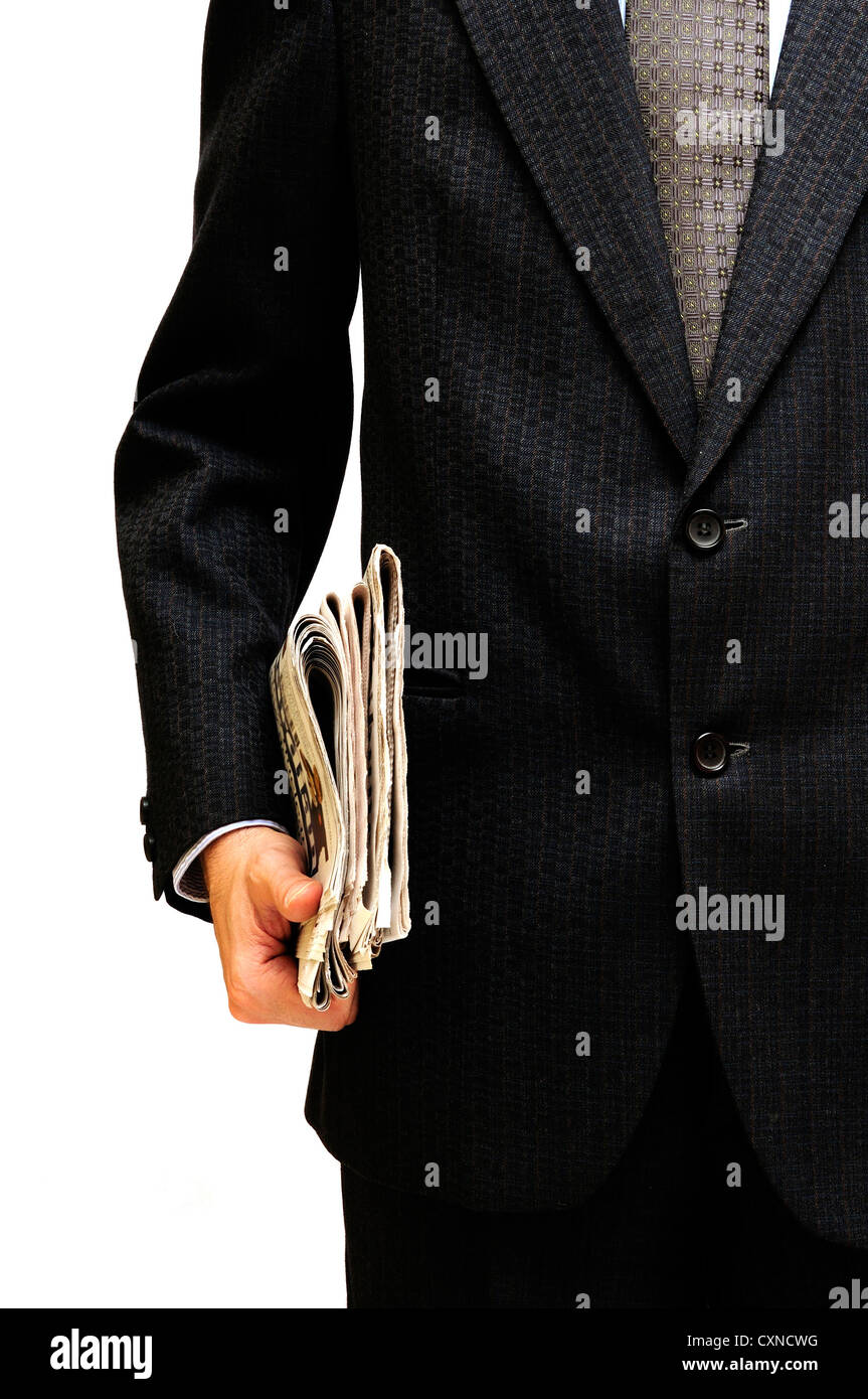 a businessman holding newspapers in his hand Stock Photo - Alamy