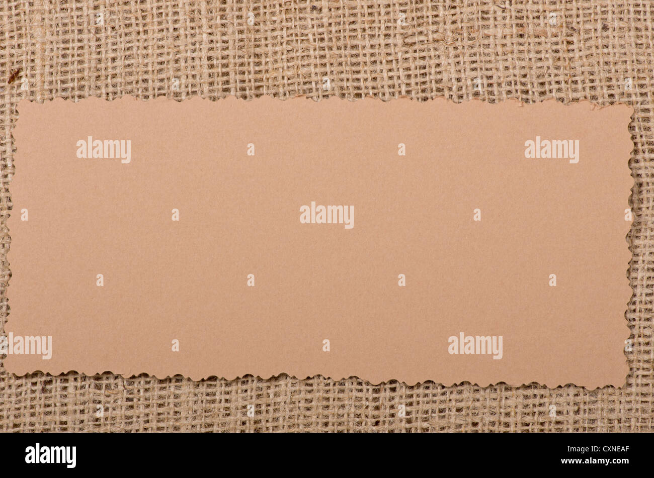 Old paper tag on natural burlap Stock Photo - Alamy