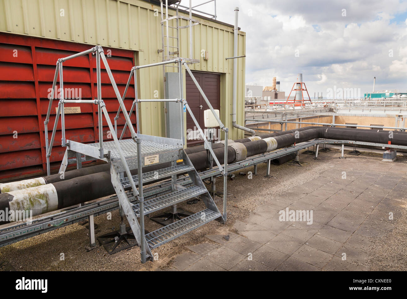 steps giving access over roof top industrial plant pipework Stock Photo ...