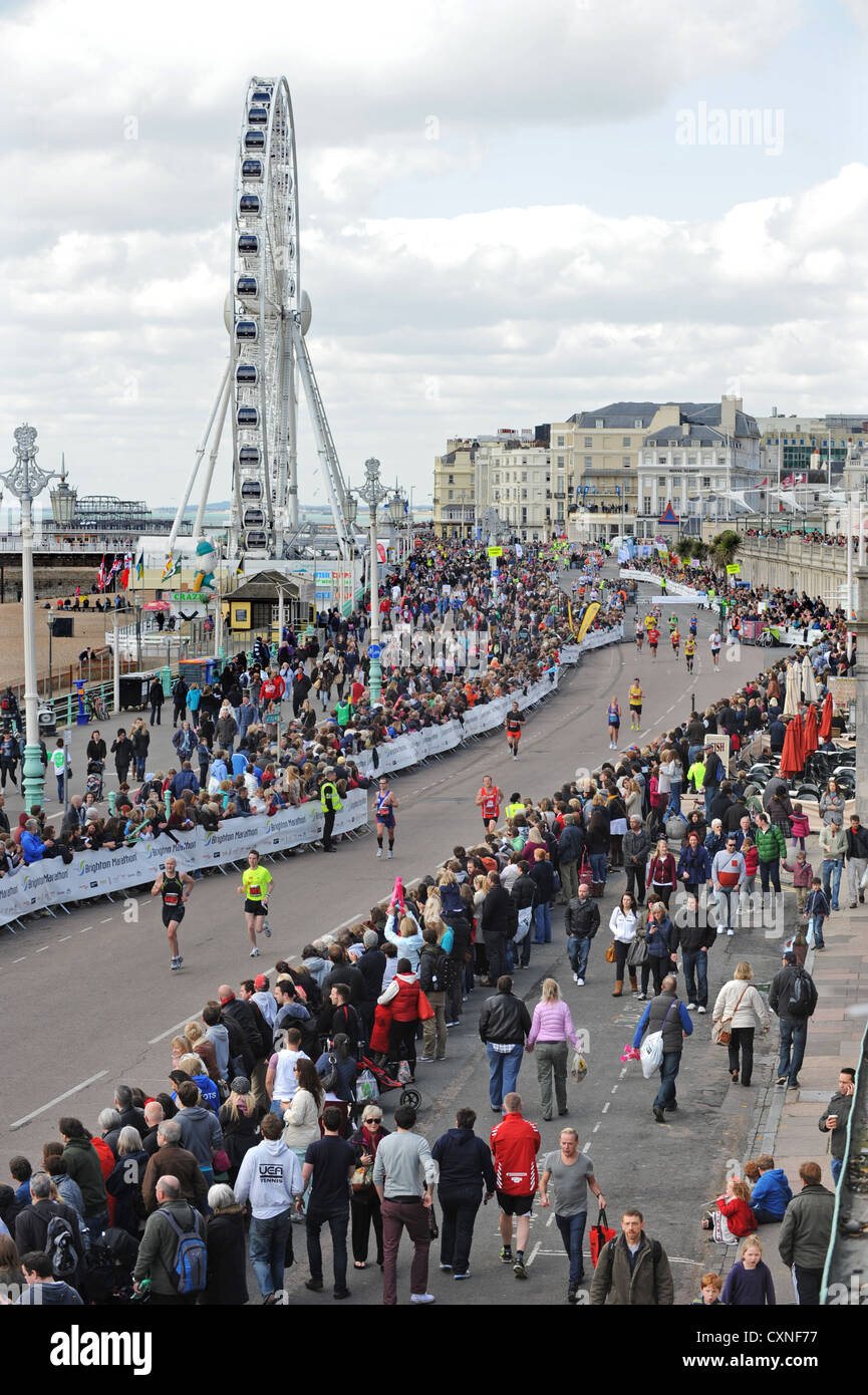 A packed seafront as runners head for the finish line during the ...